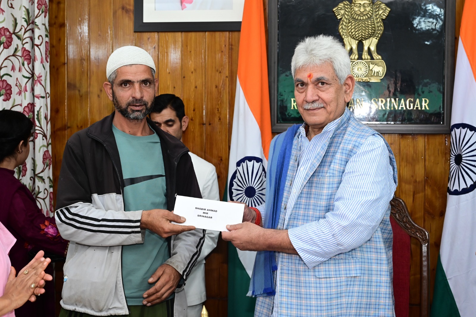 LG hands over land allotment orders to landless beneficiaries of PMAY-G ...